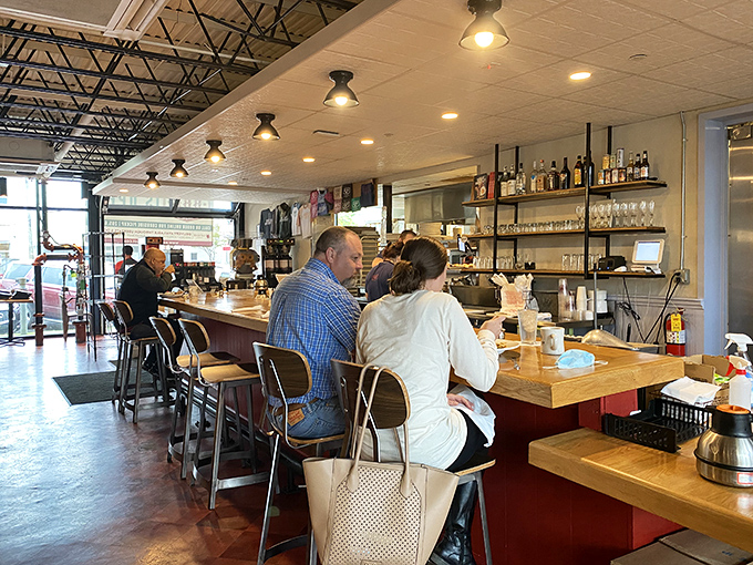 The counter seats—where breakfast enthusiasts become temporary family, united by coffee and the universal language of "pass the hot sauce, please."