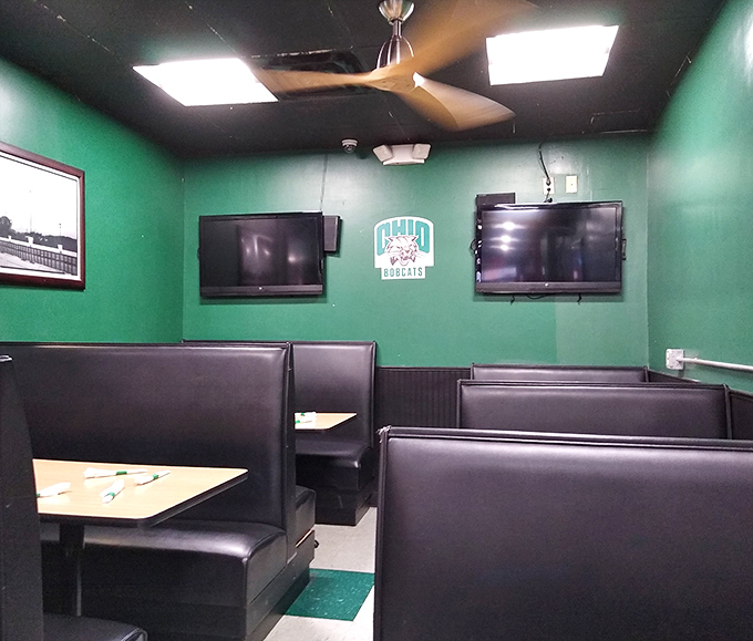 Green walls and black booths create the perfect backdrop for Ohio University sports viewing and post-exam celebration meals.