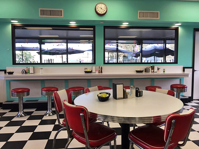 The round table by the window&mdash;prime real estate for hashbrown enthusiasts and coffee philosophers alike.