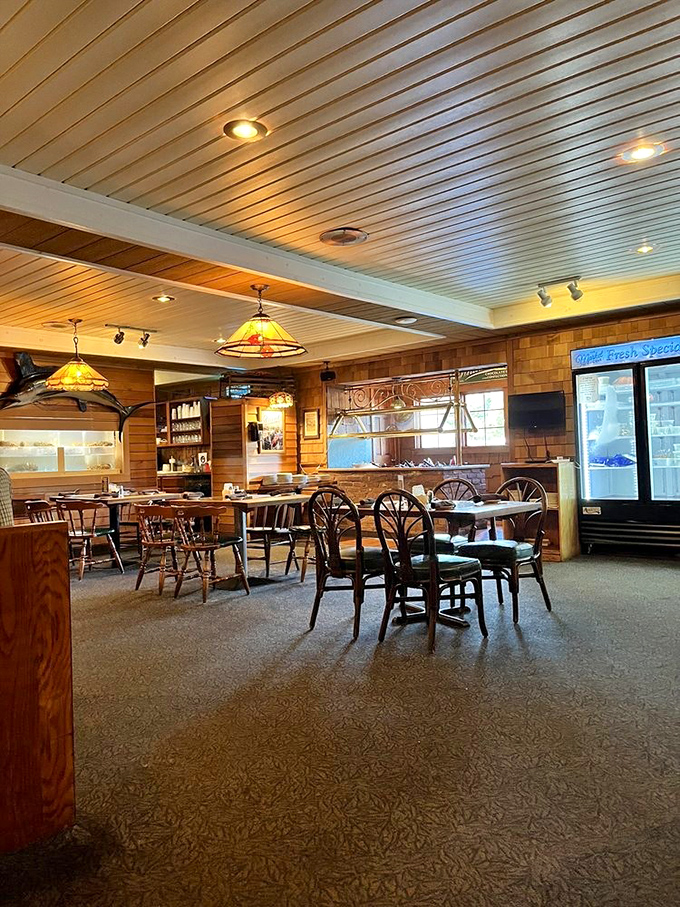 The dining room's warm wood tones and nautical touches create an atmosphere that says "relax, you're about to eat really well."