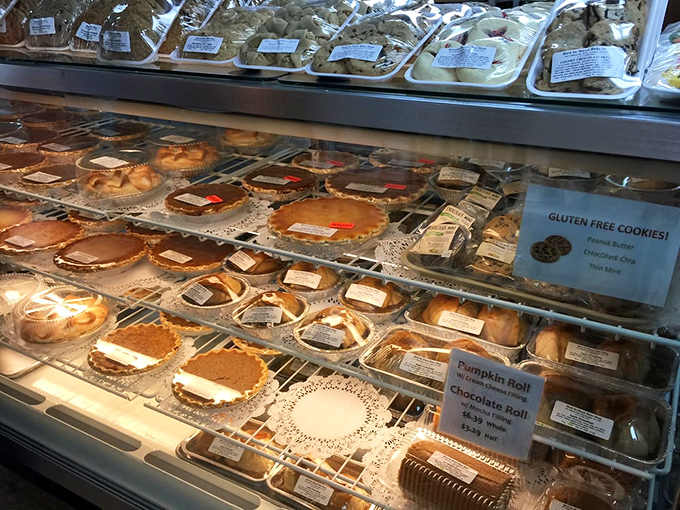 The display case: where diet resolutions go to die gloriously. Each shelf a different chapter in the story of "I'll start tomorrow."