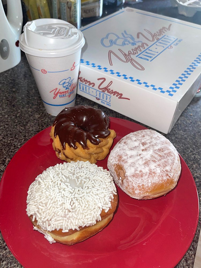 Morning bliss, perfectly packaged. Three donuts and coffee&mdash;the breakfast equivalent of hitting a culinary jackpot before your day even begins.