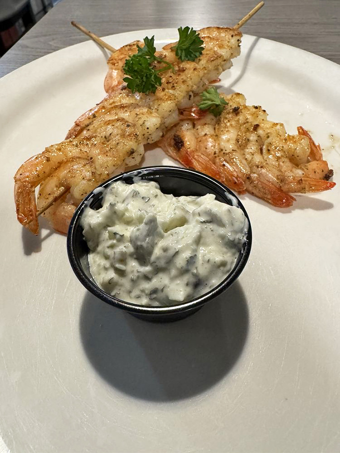 Shrimp skewers that look like they jumped straight from Gulf waters onto the grill. That herb-flecked tartar sauce isn't just a condiment&mdash;it's a companion.