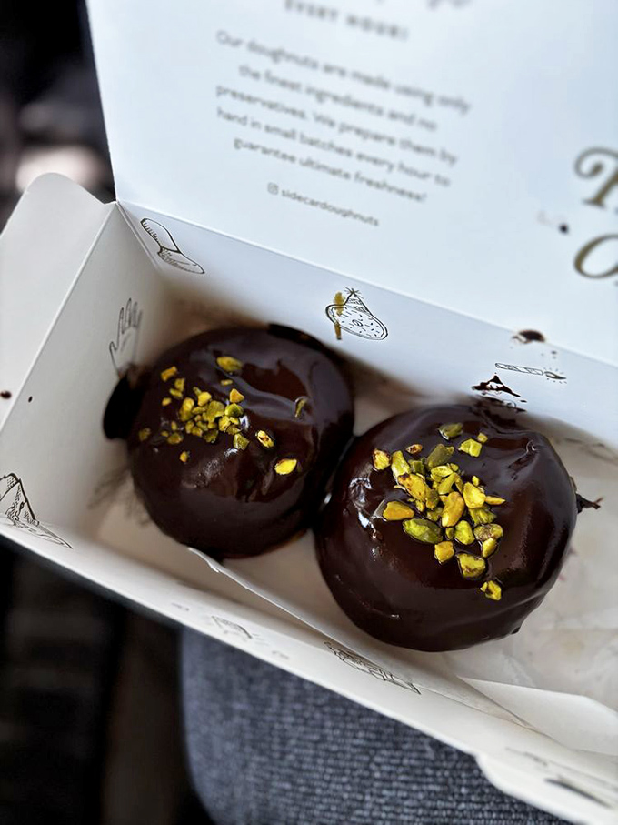 Chocolate donuts adorned with pistachios&mdash;a sophisticated pairing that makes your average donut seem like it never really tried.
