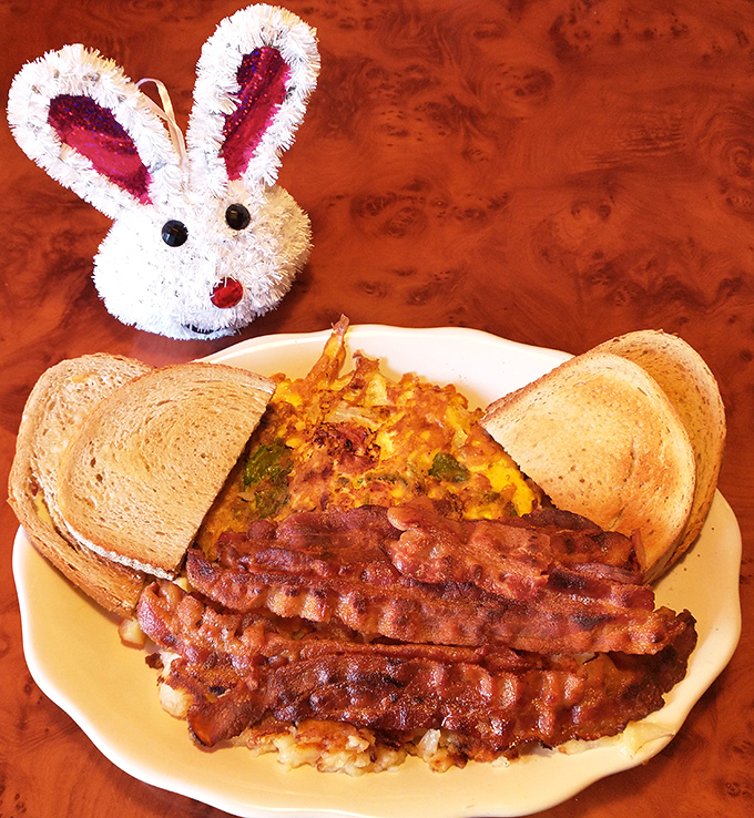 Easter breakfast done right &ndash; a veggie-packed omelet, perfectly crisped bacon, and toast standing by for yolk-sopping duty.