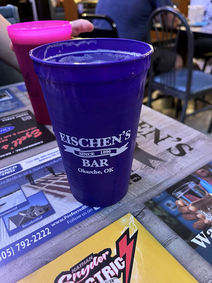 Vibrant branded cups prove even drinks dress for the occasion at Eischen's - this purple chalice is ready for your beverage of choice.