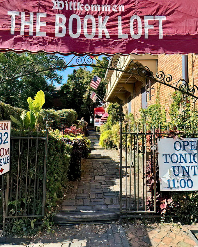 The wrought-iron gate entrance feels like passing into a secret garden of stories. "Open until 11:00" is music to night owls' book-loving ears.