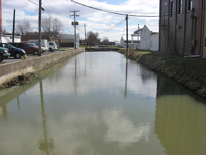 The Miami and Erie Canal still flows through town, a liquid timeline connecting modern Delphos to its watery origins with quiet persistence.