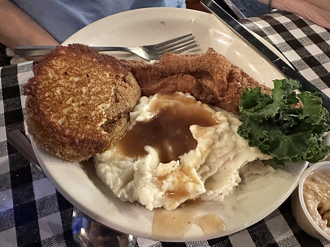 A plate that proves fish doesn't need an ocean nearby to taste this good. Those crispy edges tell stories of perfect temperature and timing.