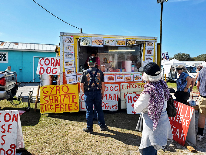 The universal language of hand-painted food signs promising everything from gyros to corn dogs—culinary diplomacy at its finest.