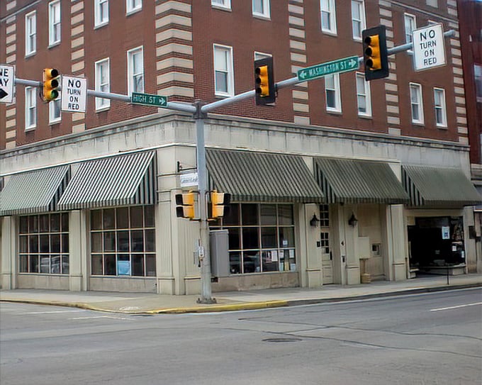 The historic Fort Jackson Hotel building stands sentinel at a key intersection. Where modern traffic lights meet timeless architectural details. 