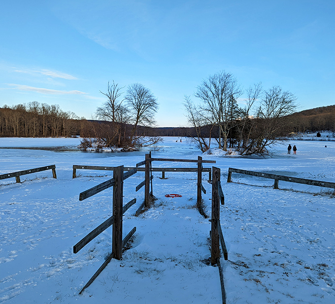 Winter transforms Hopewell Lake into nature's ice rink. Those brave souls in the distance clearly didn't get the "hibernate until spring" memo. 