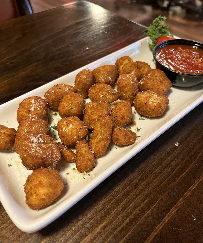 These golden-fried cheese curds don't squeak&mdash;they sing. Crispy outside, molten Wisconsin cheese inside, with marinara standing by for the perfect dunk.
