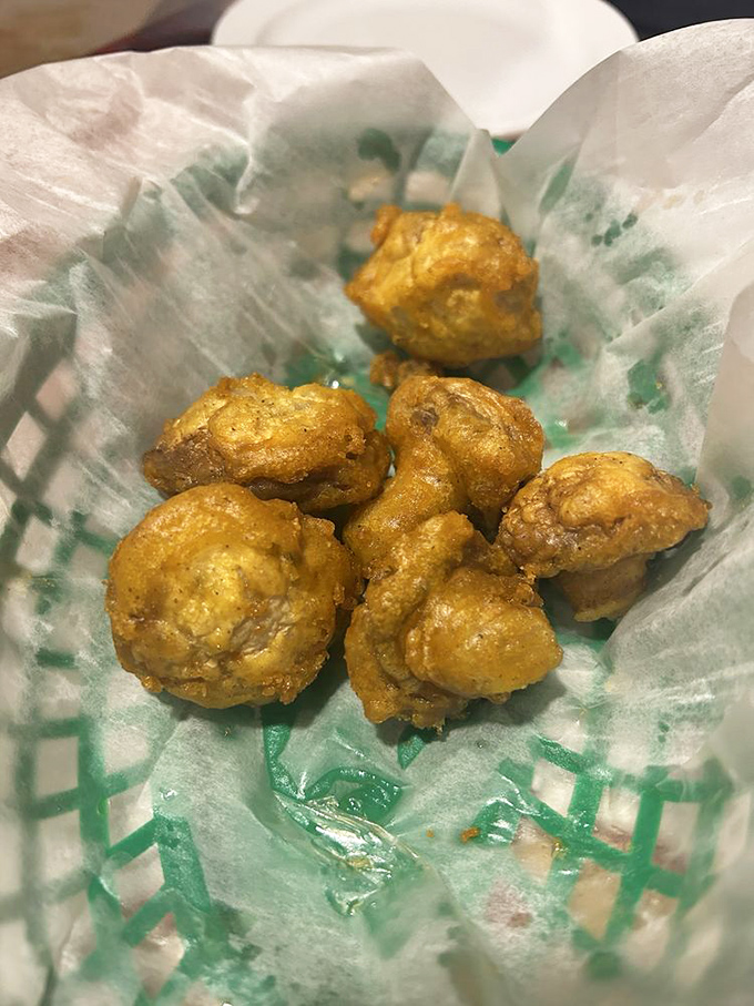 Fried mushrooms: proof that sometimes the best things in life are simple, golden, and come in a paper-lined basket.