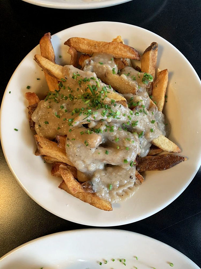 These aren't just fries with gravy&mdash;they're potato vessels for savory, herb-flecked goodness. The kind of dish that ruins regular fries for you forever.