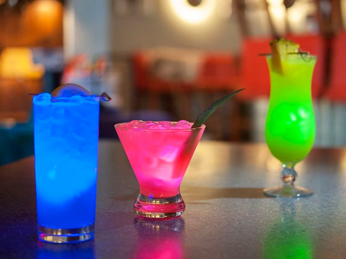 These electric-hued cocktails don't just quench your thirst—they put on a neon light show that would make Las Vegas envious.