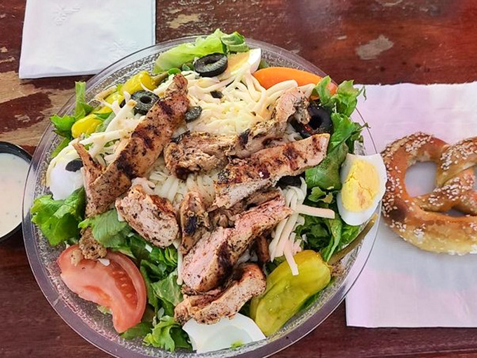 A salad that doesn't feel like punishment. Protein, crunch, and color with a pretzel sidekick that understands the meaning of balance.