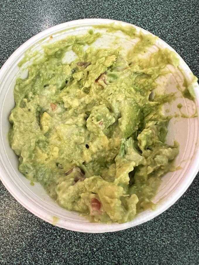 This isn't just guacamole; it's a chunky avocado masterpiece with the perfect ratio of lime, onion, and cilantro that makes store-bought versions weep with inadequacy.