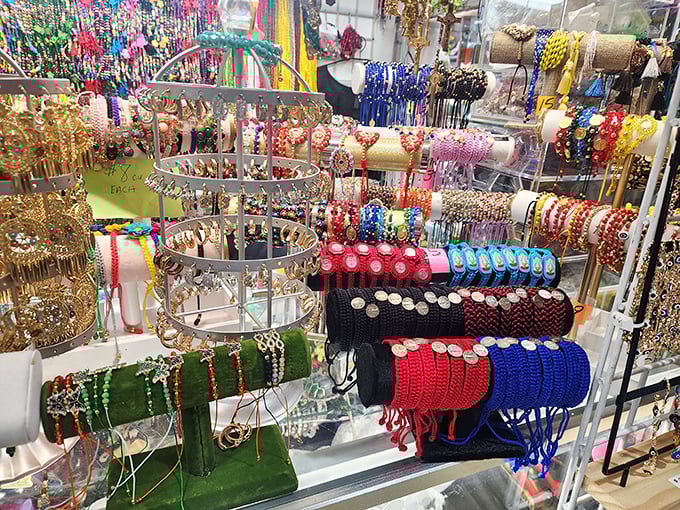 A kaleidoscope of handcrafted jewelry that transforms simple display stands into miniature art galleries. Wearable treasures at every turn.