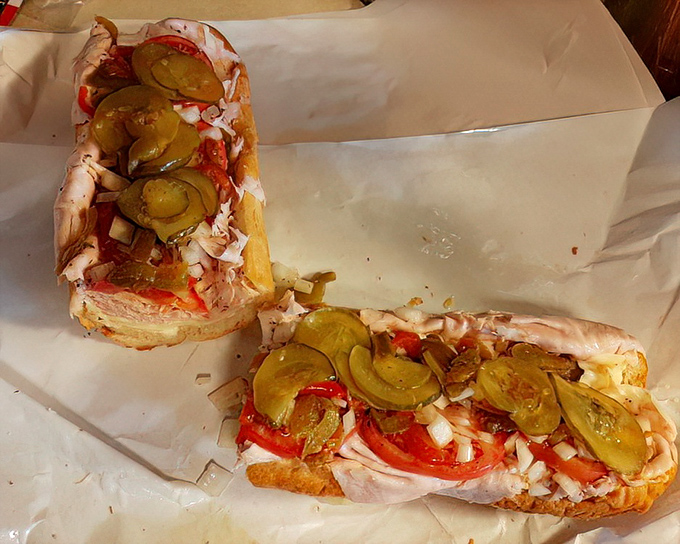 The cross-section reveals the truth: no skimping here. Every bite delivers the perfect ratio of meat, toppings, and that crusty-yet-soft bread.