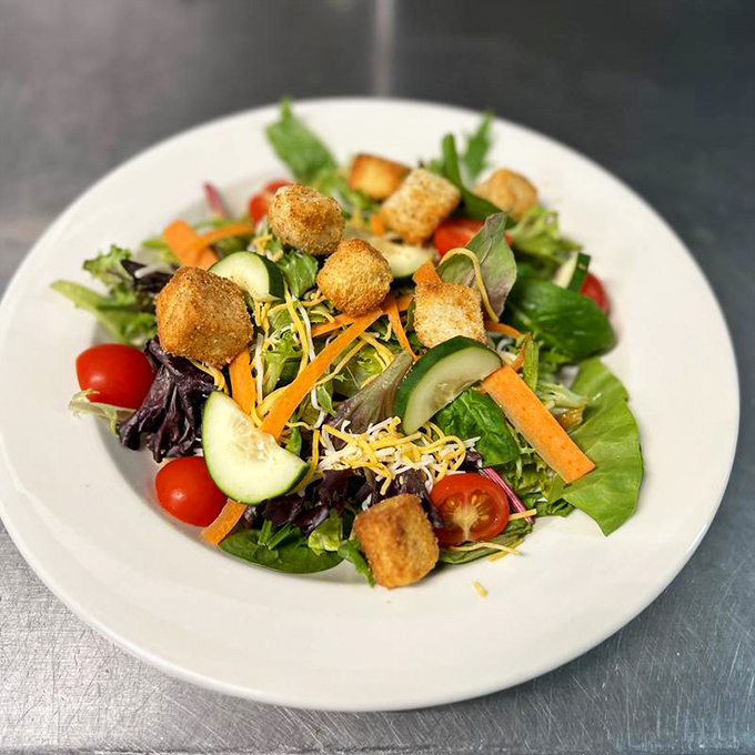 A garden party on a plate where every vegetable plays supporting actor to those golden crouton stars. Fresh, crisp, and ready for its close-up.