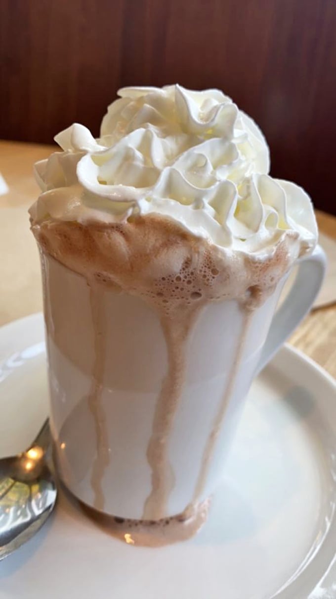Hot chocolate that's dressed for a special occasion, with whipped cream piled higher than Portland winter clouds. 