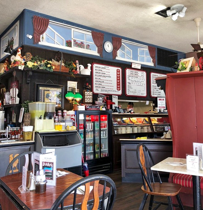 Vintage pendant lights hang from the ceiling like jewelry, illuminating a space where fried chicken dreams come true daily.