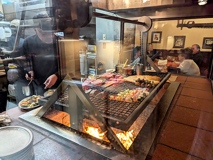 Where the magic happens: flames dance beneath seasoned grates as meats transform from promising to transcendent before your eyes.
