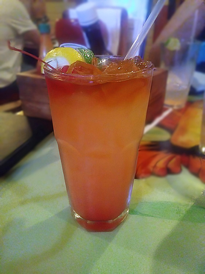 A Jamaican Sunset cocktail that tastes like vacation in a glass. The kind of drink that makes you temporarily forget about your inbox.