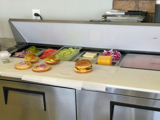 Where burger magic happens. Fresh ingredients lined up like soldiers ready for delicious duty&mdash;a glimpse behind the curtain of flavor.