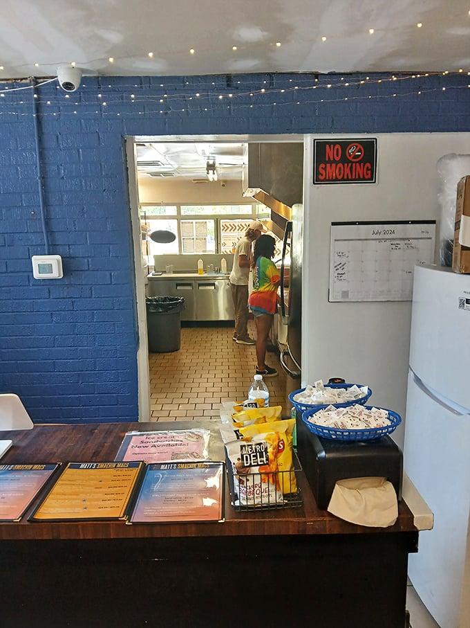 A glimpse into the kitchen where mac and cheese dreams are born, with blue walls that match the depth of cheese-induced happiness.