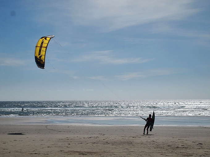 Kiteboarding at Manzanita: where humans harness wind and water to experience the closest thing to flying without growing wings.