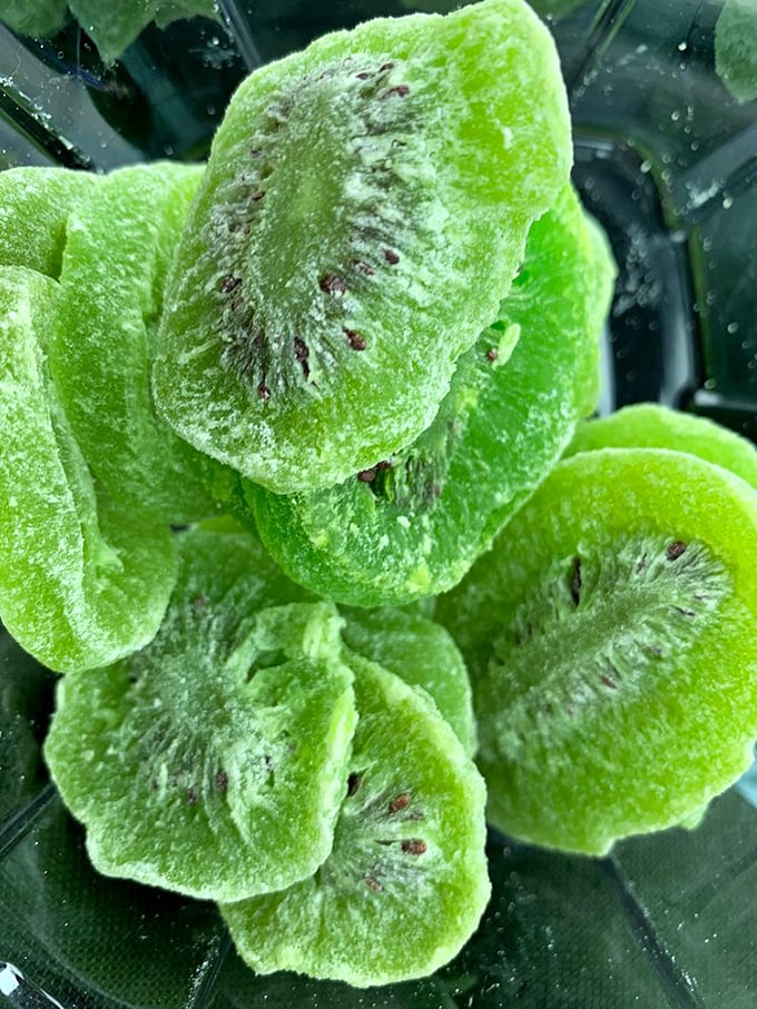 Vibrant crystallized kiwi slices glisten like jewels. The perfect balance of sweet and tart makes these fruit gems disappear faster than your resolution to "just browse."
