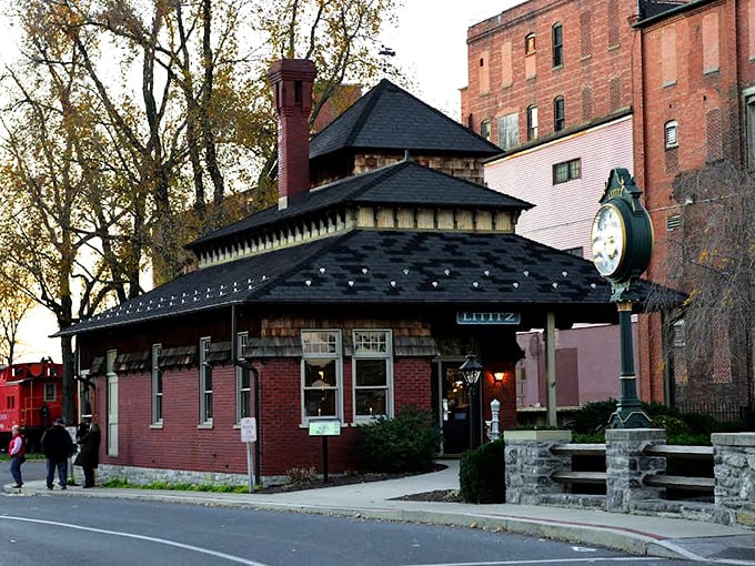 The Lititz Train Station clock tower stands as a sentinel of bygone days, when rail was king and travelers arrived with trunks instead of rolling suitcases.