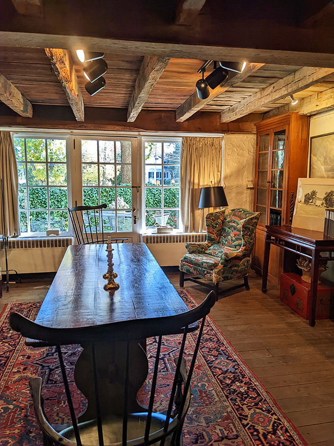 A reading nook fit for literary royalty. That wingback chair has probably hosted more adventures than Indiana Jones.