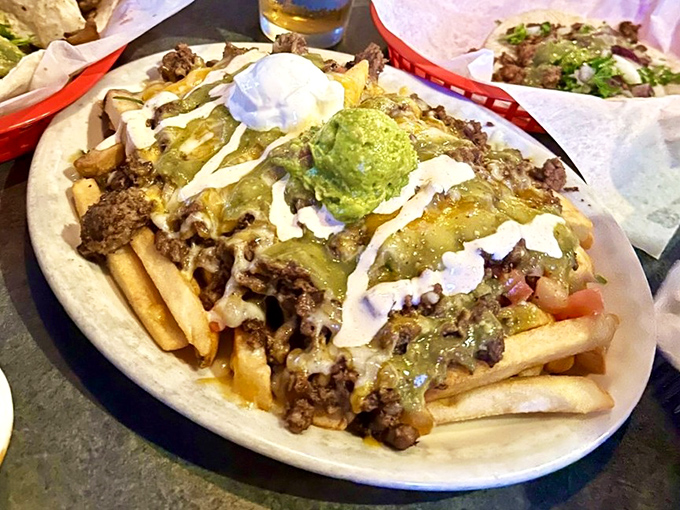 Loaded fries that answer the eternal question: "What if nachos and french fries had a beautiful, cheese-covered baby?"