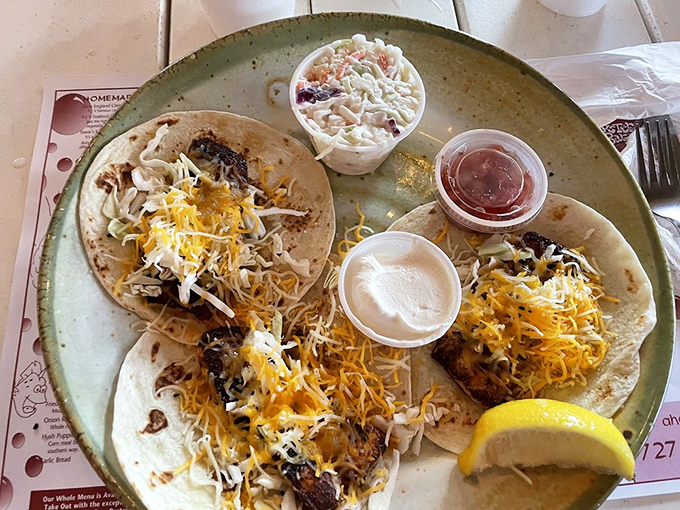 These fish tacos aren't just a meal, they're a fiesta on a plate &ndash; blackened mahi-mahi topped with melted cheese and fresh cabbage.