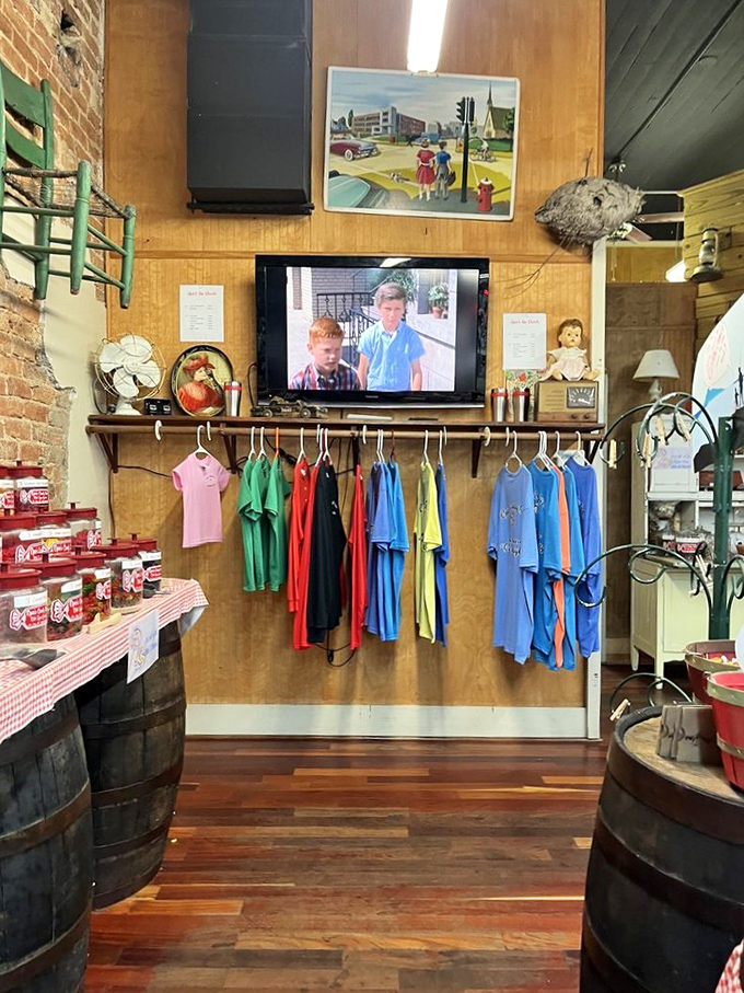 A television playing Andy Griffith episodes while T-shirts stand at attention. In Mayberry's spiritual homeland, even the merchandise whistles that famous theme song.