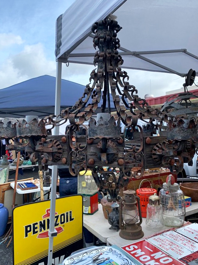 Industrial art meets functional lighting in this rusted iron chandelier. Imagine the stories it could tell about the space it once illuminated.