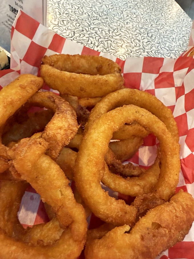 Onion rings so perfectly golden and crispy they deserve their own theme song. These aren't sides&mdash;they're the main event.