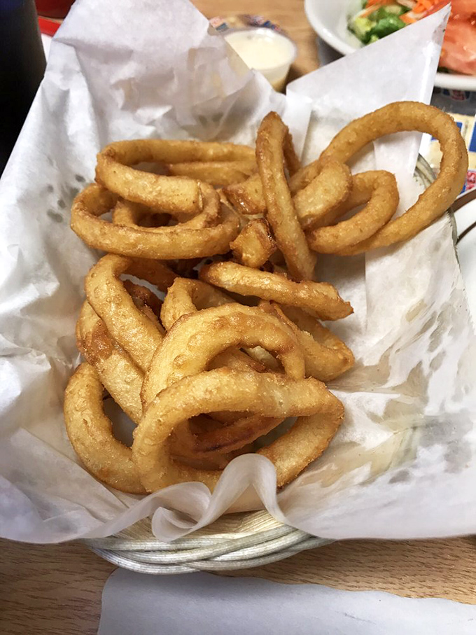 Onion rings nestled in paper&mdash;the diner equivalent of diamonds in a jewelry box. Crispy, golden treasures that disappear all too quickly.