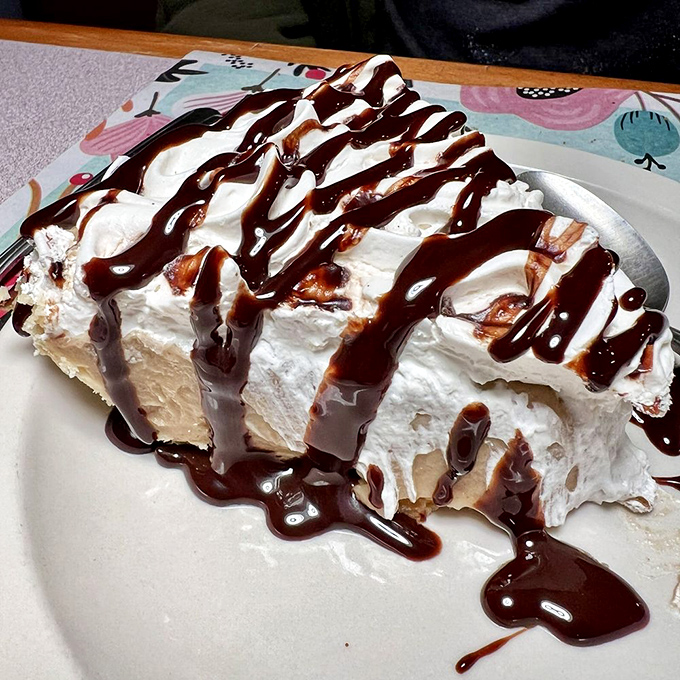 A slice of heaven topped with chocolate drizzle&mdash;because after conquering a mountain of fried chicken, you deserve a sweet victory lap.