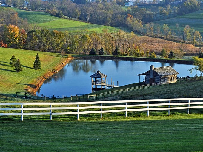 Rolling hills, a serene pond, and a rustic cabin create the kind of pastoral perfection that makes city dwellers question their life choices.