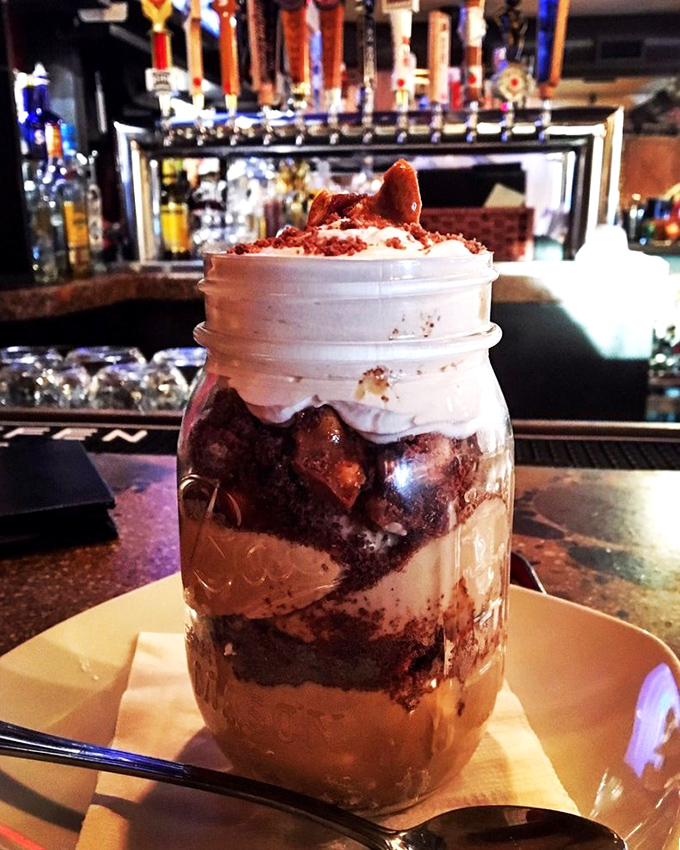 Dessert that refuses to be confined to a plate. This layered Mason jar creation is what childhood dreams grow up to become.