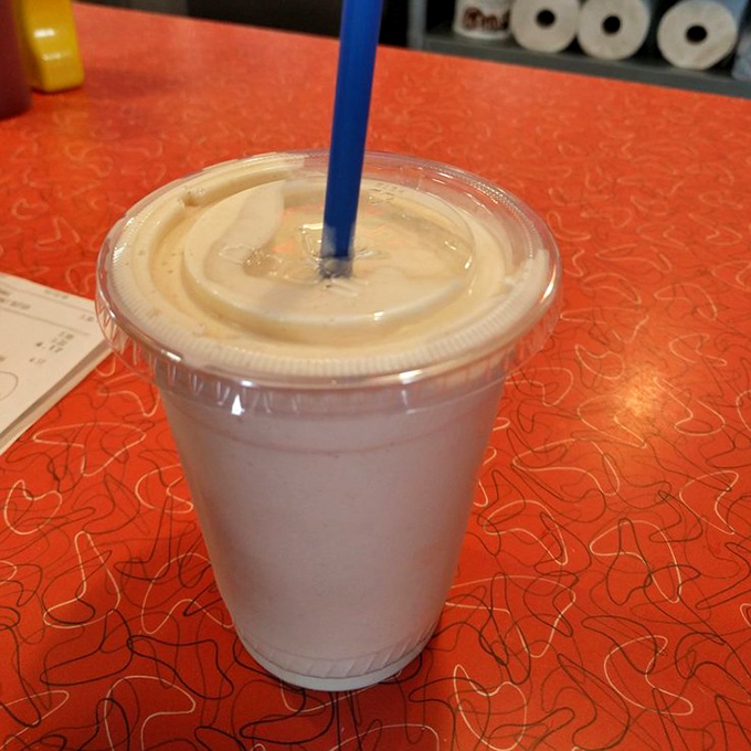 A milkshake so thick it laughs at your straw's feeble attempts. This creamy concoction demands respect, patience, and eventually, a spoon.