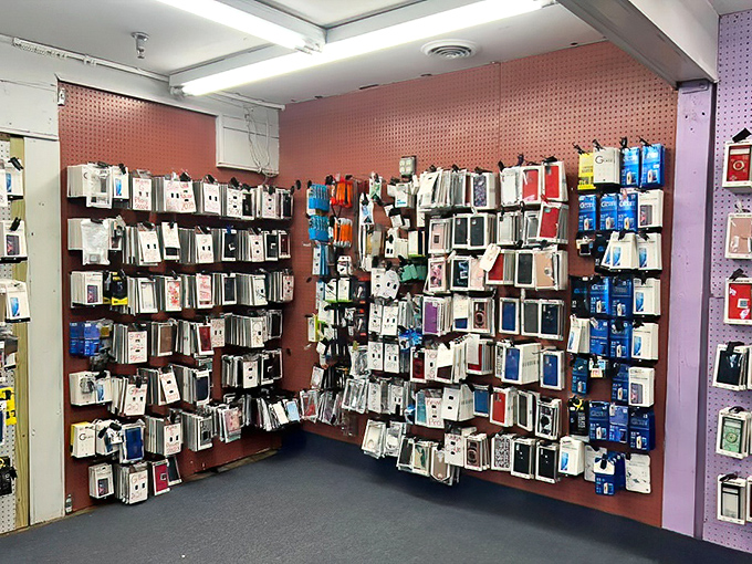 The modern bazaar&mdash;where phone cases hang like technological tapestries in a gallery of digital accessories.