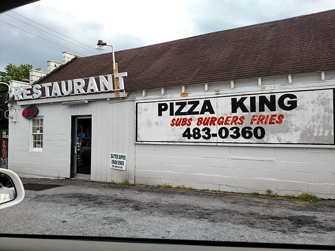 Pizza King's no-frills exterior hides a local institution where generations have gathered for slices of small-town comfort.