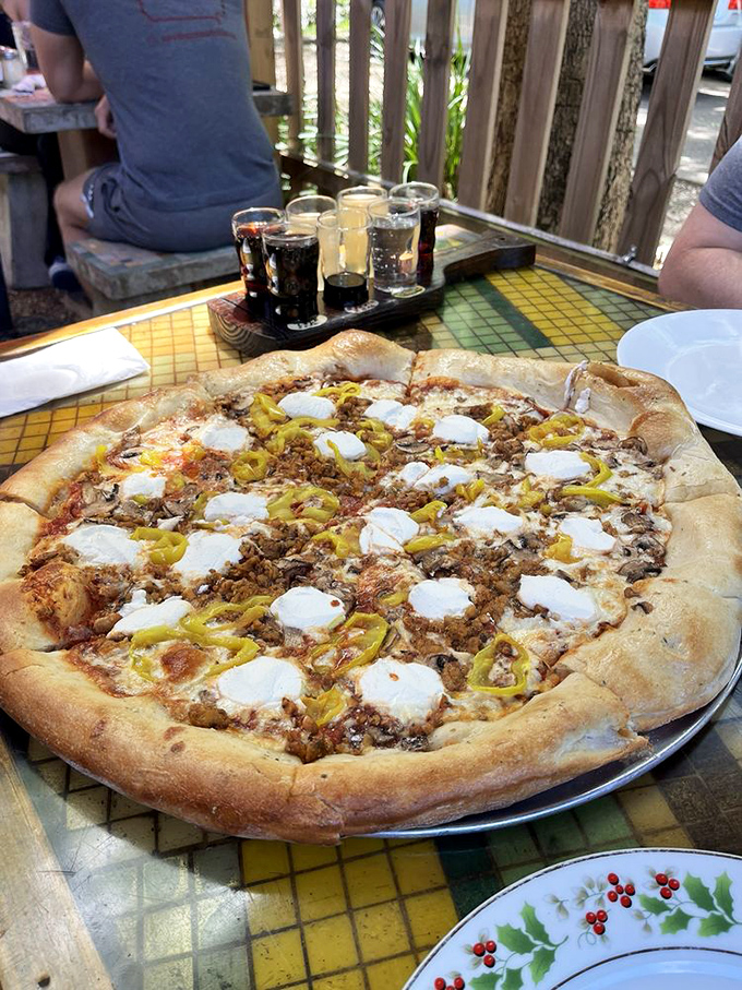 Pizza architecture at its finest. The puffy, golden crust creates the perfect foundation for savory toppings and pools of melted cheese in this edible art piece.