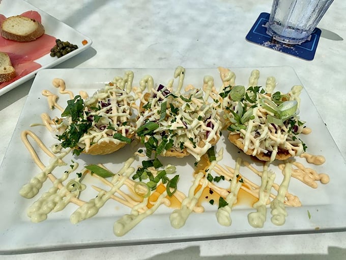 Artfully presented small bites that prove seafood can be both sophisticated and playful&mdash;the drizzles of sauce adding that perfect chef's-kiss finish.