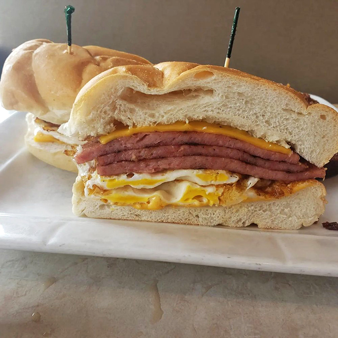 The holy trinity of breakfast sandwiches: golden eggs, melty American cheese, and Jersey's own pork roll, all nestled in a pillowy roll. Morning salvation has arrived.